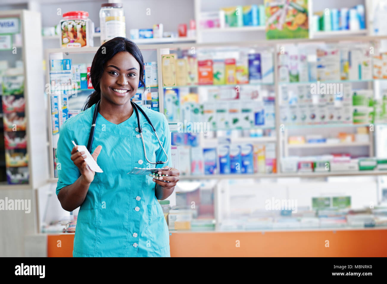 African american pharmacist working in drugstore at hospital pharmacy ...