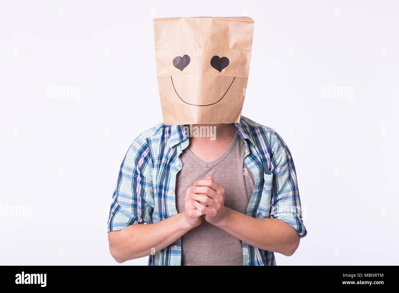 Love, emotion and relationship concept - Man with cardboard box on his ...