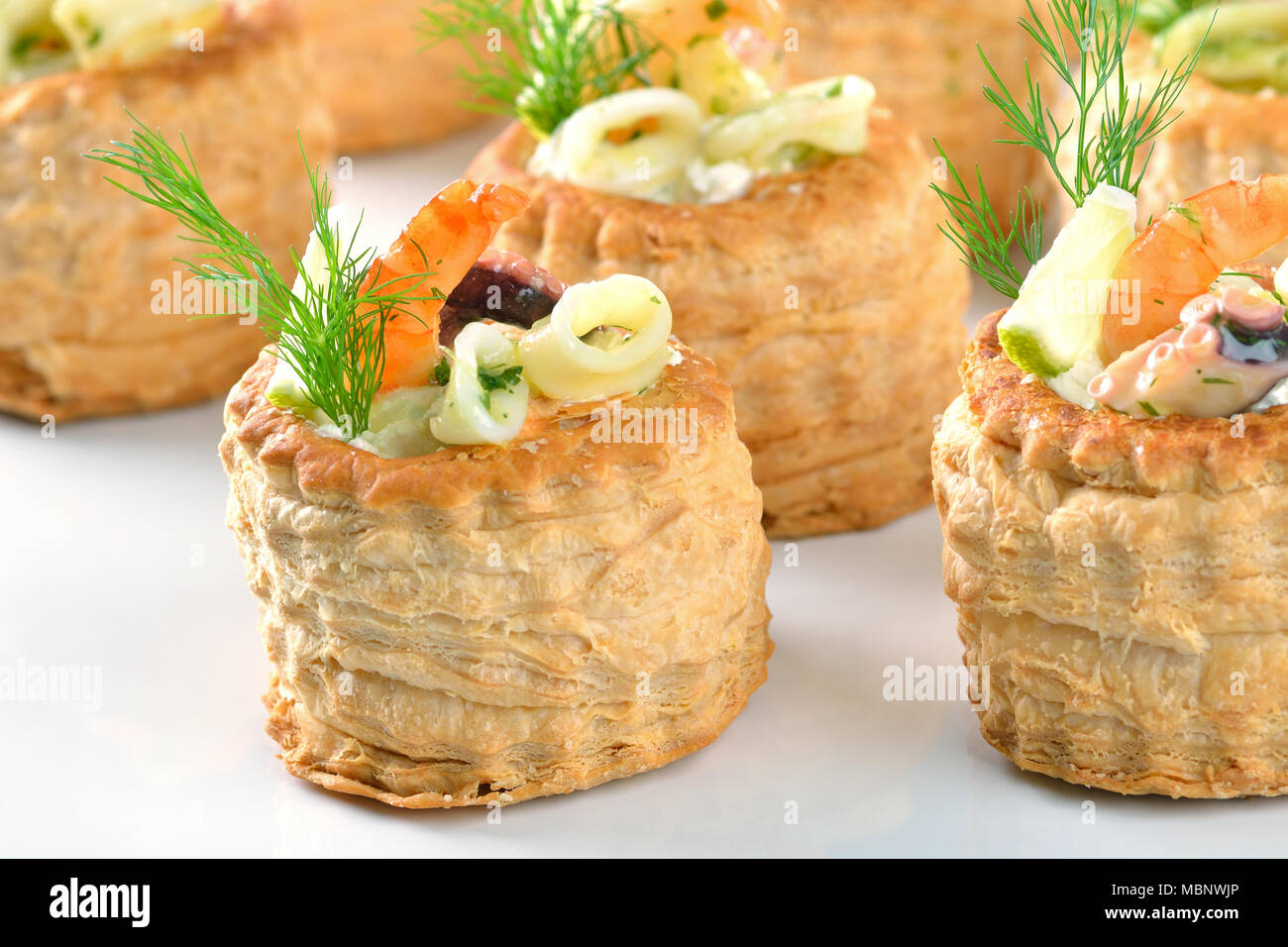 Puff pastry shells with spiced cream cheese and seafood Stock Photo - Alamy