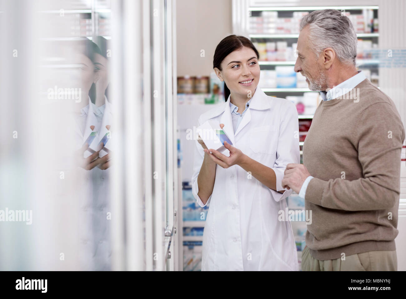 Pharmacist helping man hi-res stock photography and images - Alamy