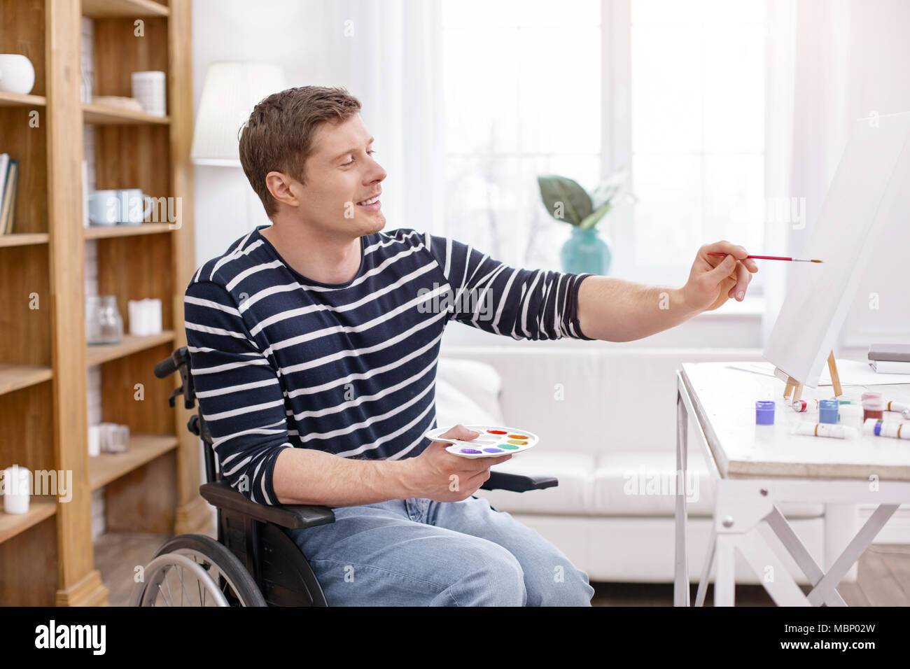 Handsome male person developing his skills Stock Photo - Alamy