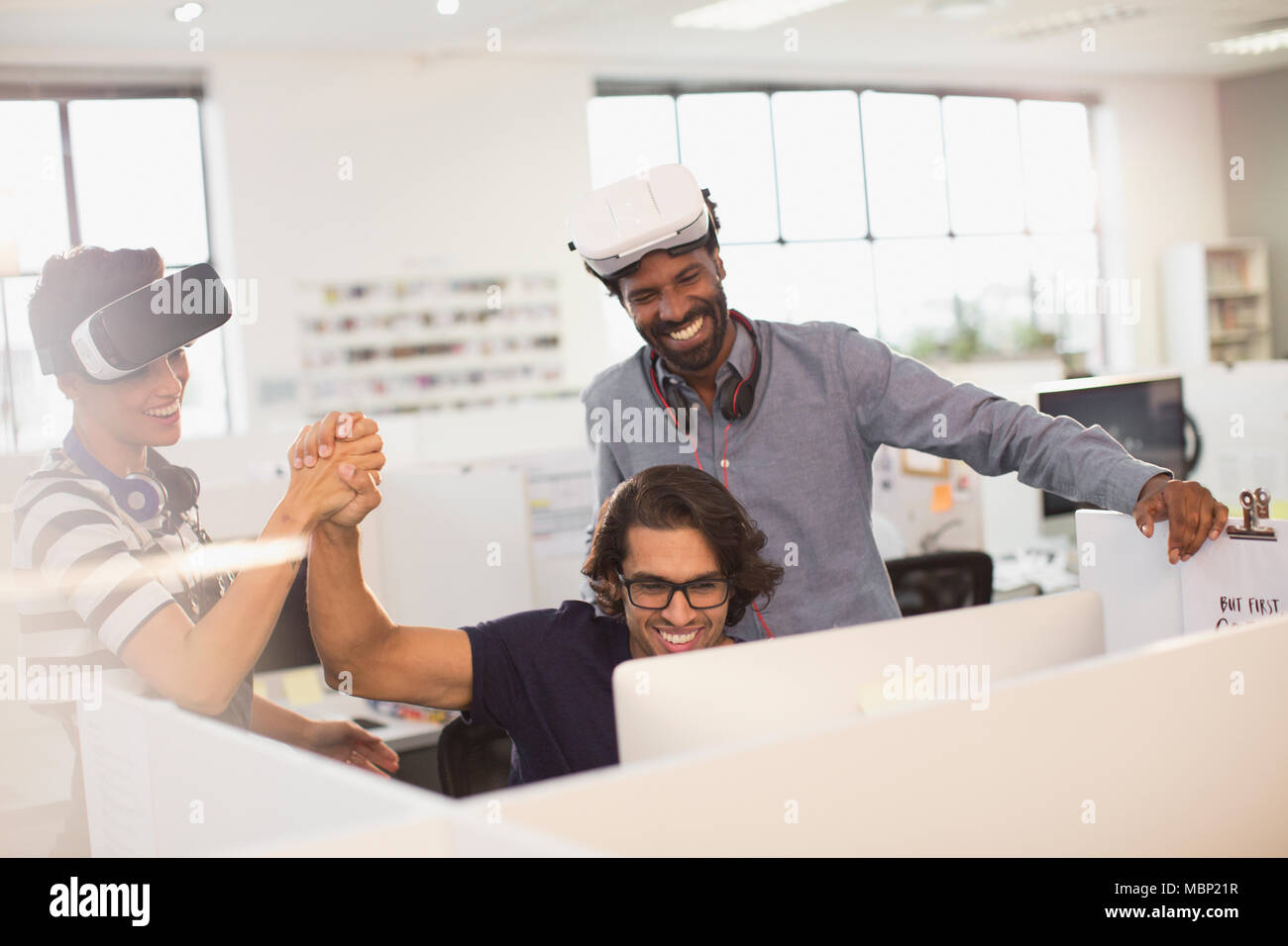 Smiling Enthusiastic Computer Programmers High Fiving Testing Virtual