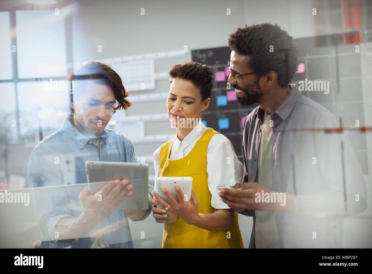 Business people using multiple digital hi-res stock photography and ...