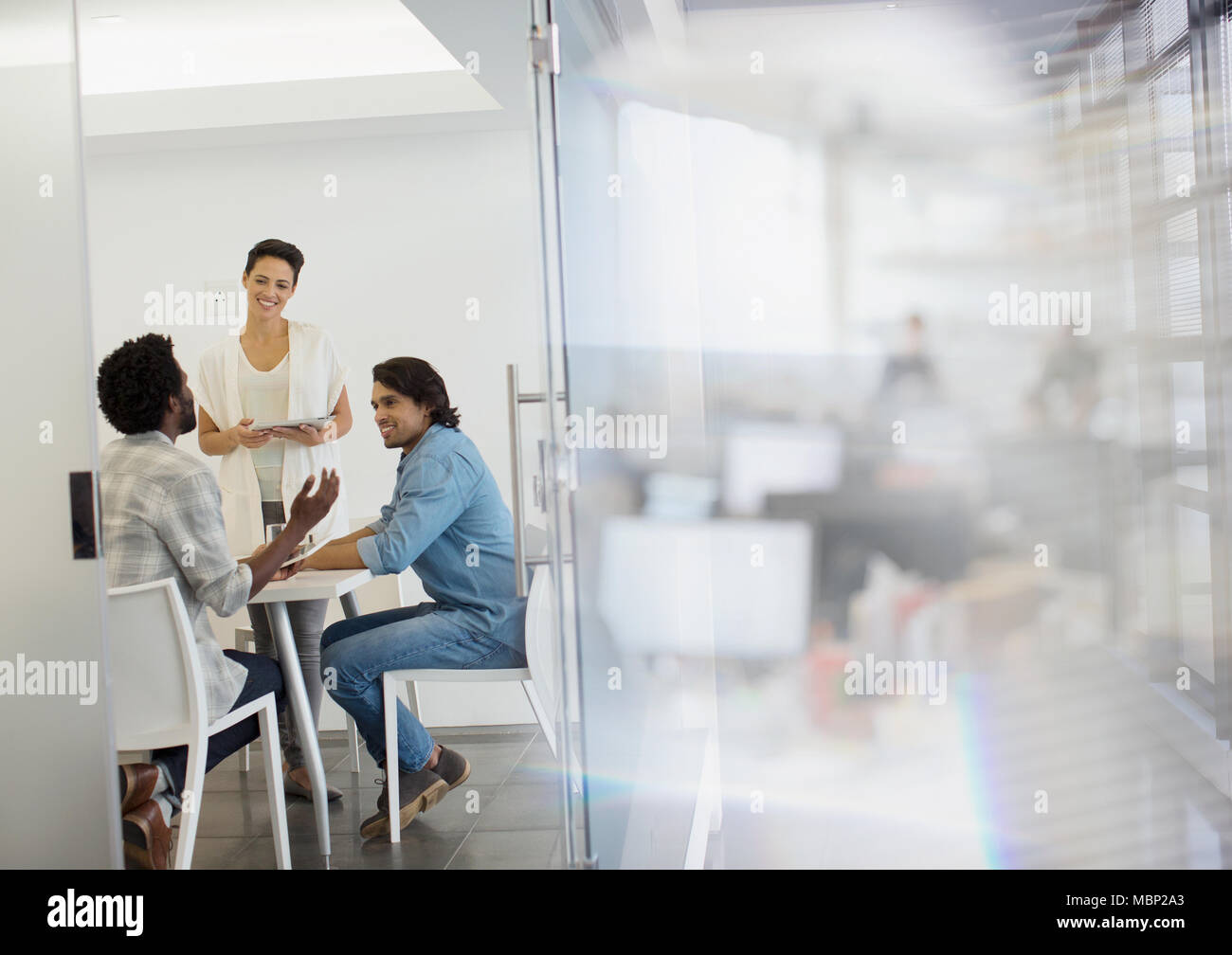 Sitting smiling communication leadership hi-res stock photography and ...
