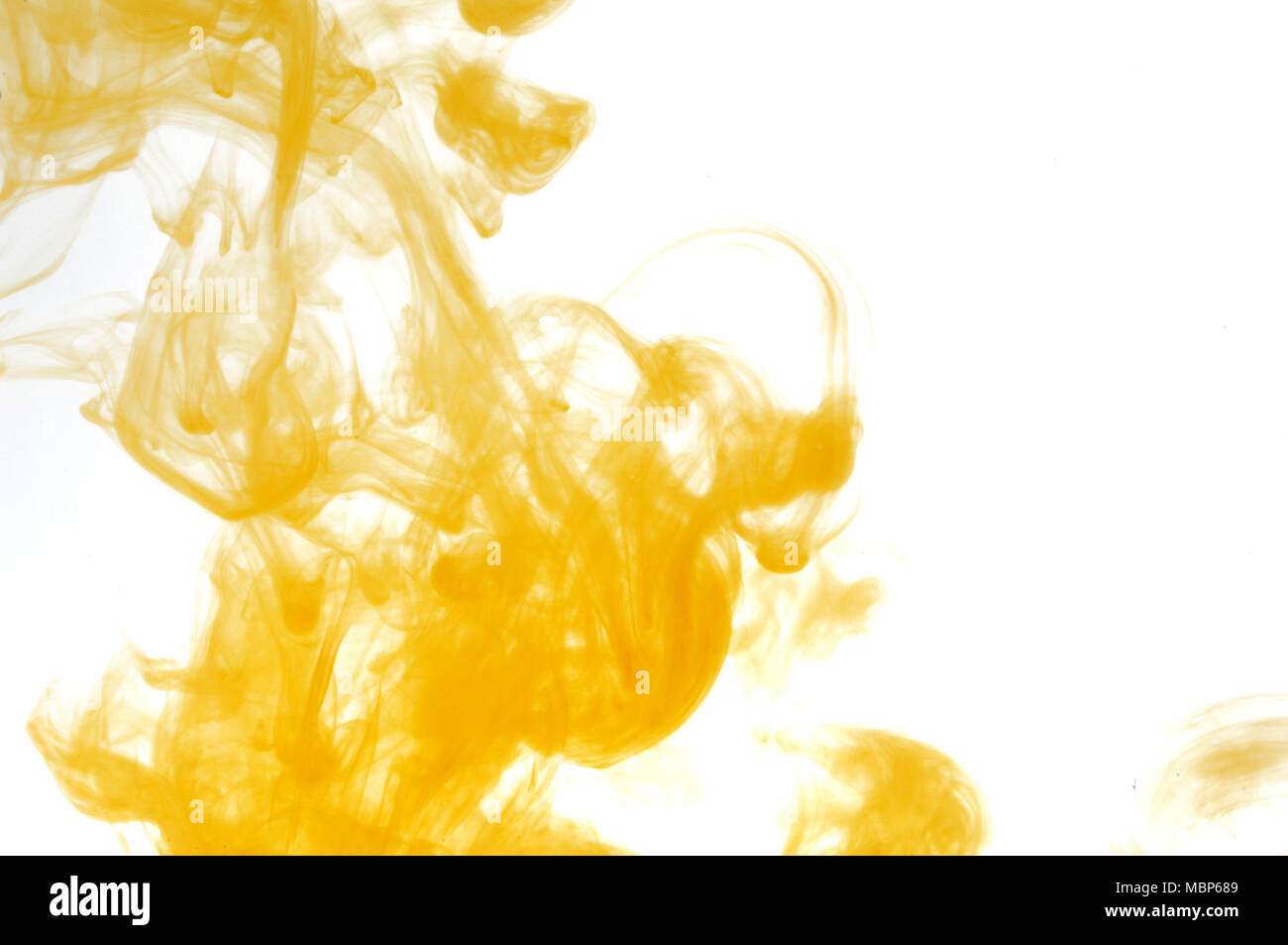 color dissolved in water with white background Stock Photo - Alamy