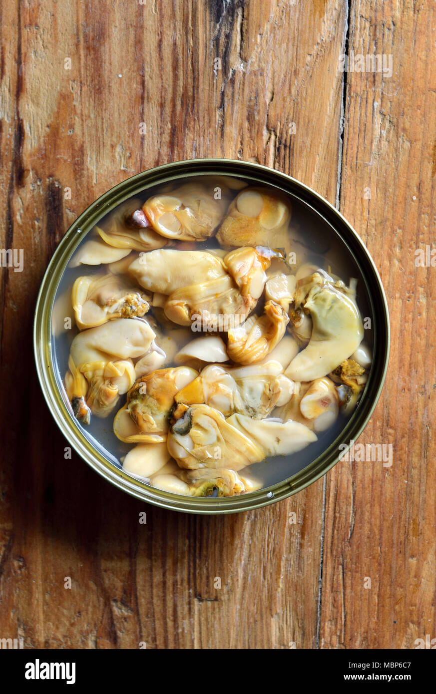 a can of clam on a table Stock Photo - Alamy