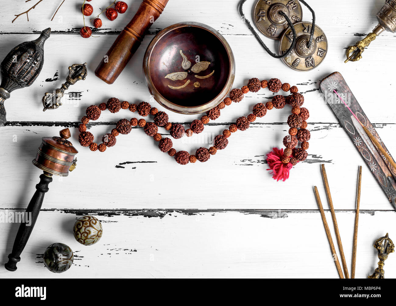 Copper singing bowl, prayer beads, prayer drum, stone balls and other ...