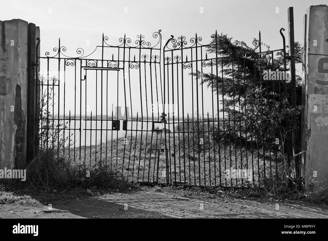 Broken Iron Gates with Power station in the background Stock Photo - Alamy