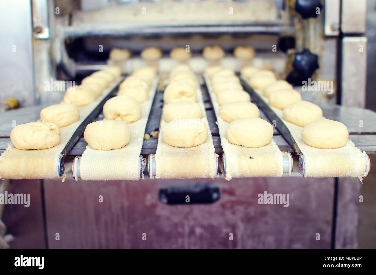 Working on a sweet pastry in a big industrial bakery Stock Photo - Alamy