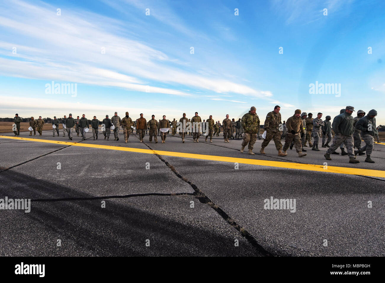 Team Moody Airmen, walk on the flight line during a foreign object ...