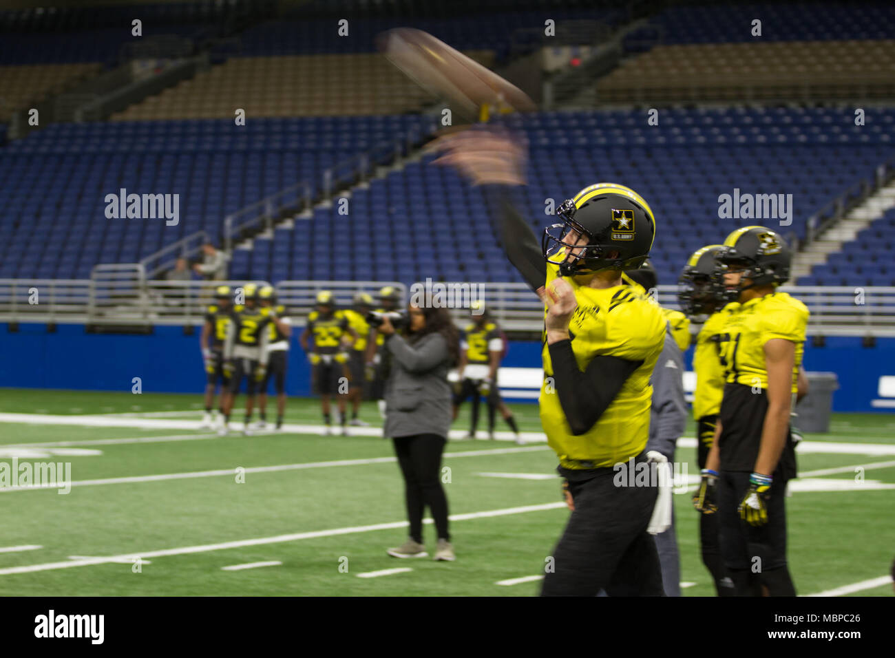 A player in the U.S. Army All-American Bowl throws the football in the ...