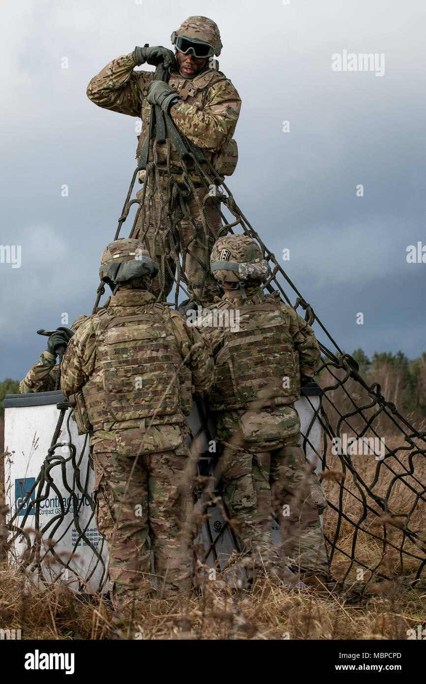 Spc. Antonio Ross (top, center), an automated logistics specialist ...