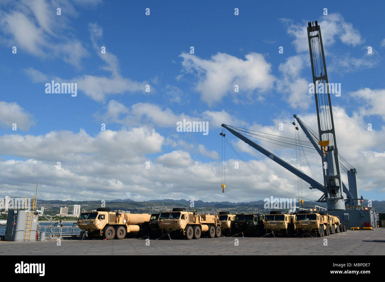 Vehicles assigned to the 25th Infantry Division, are tied on main deck ...