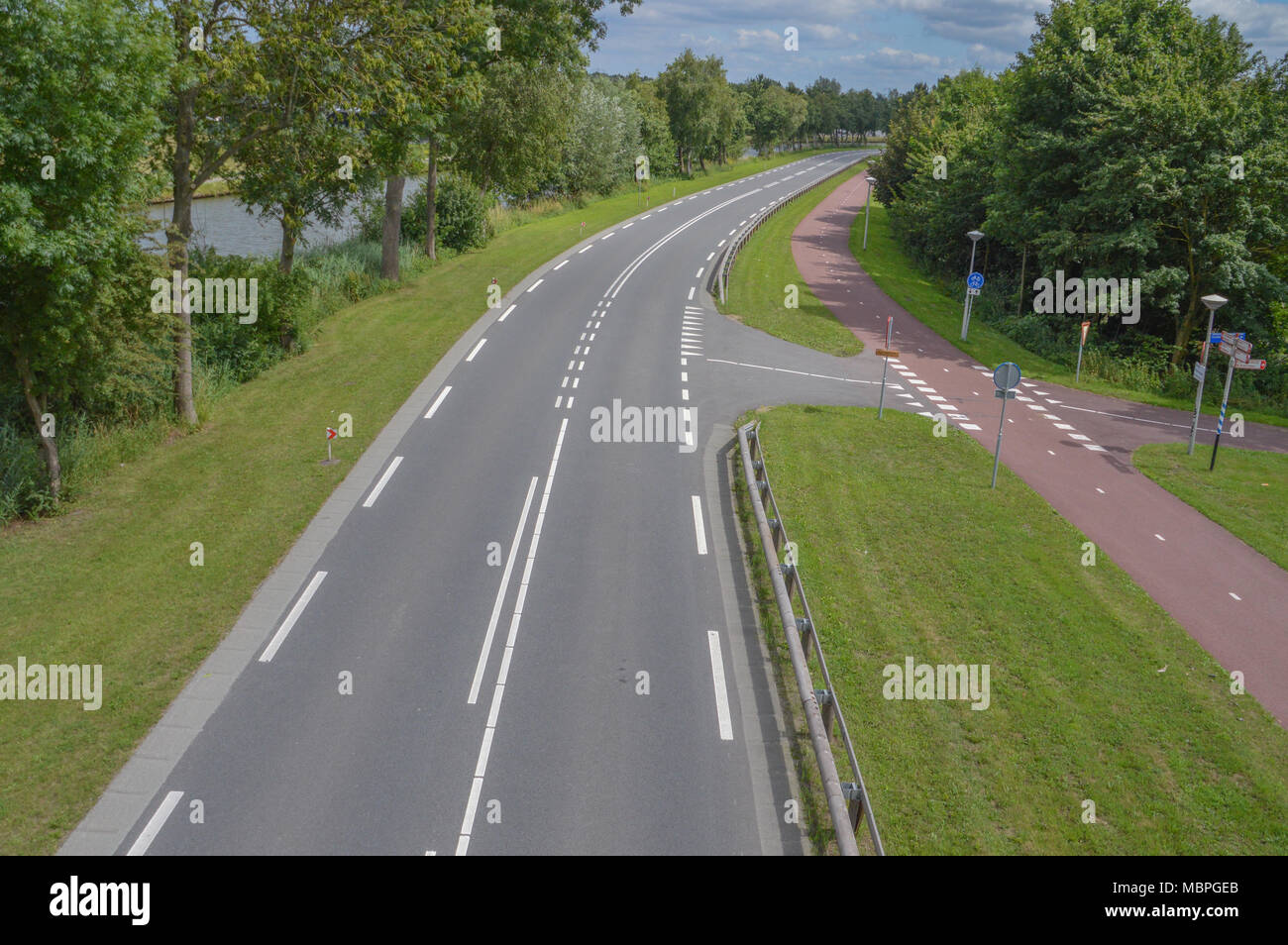 Empty Road With Bicycle Path At The Netherlands Stock Photo - Alamy
