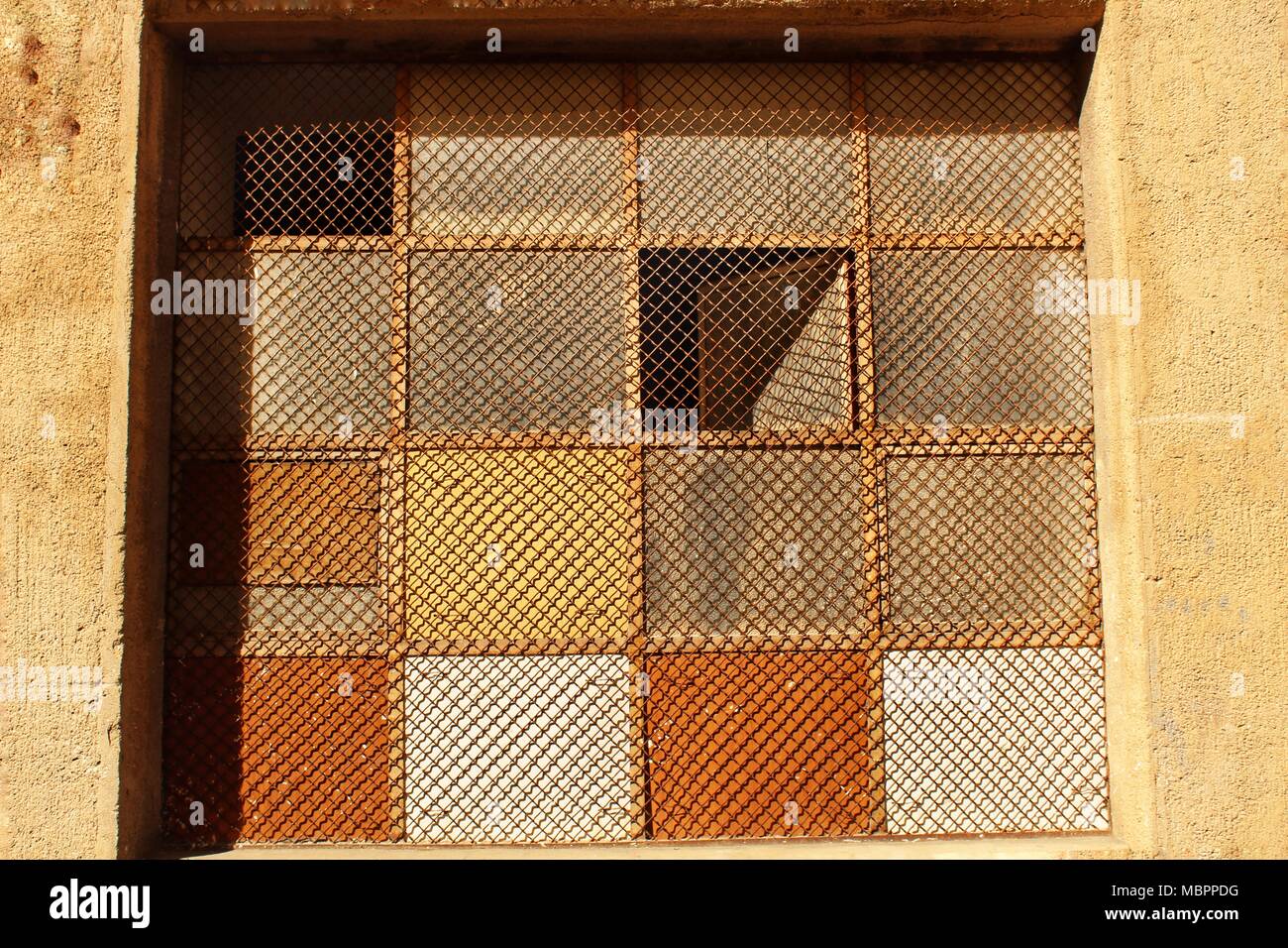 Window with metalized abstract and symmetrical grid texture Stock Photo ...