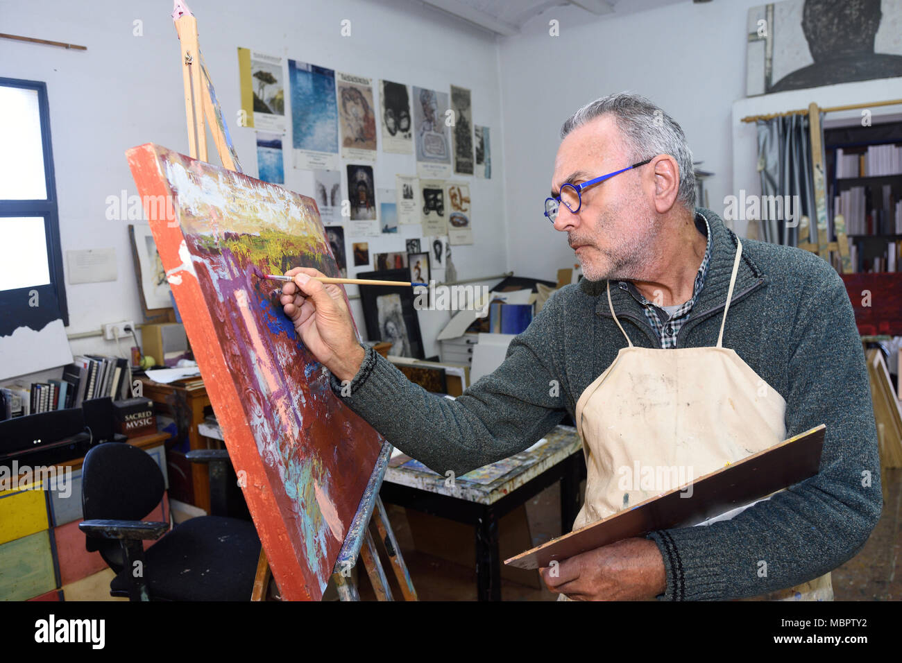 ter artist painting a picture in the studio Stock Photo - Alamy