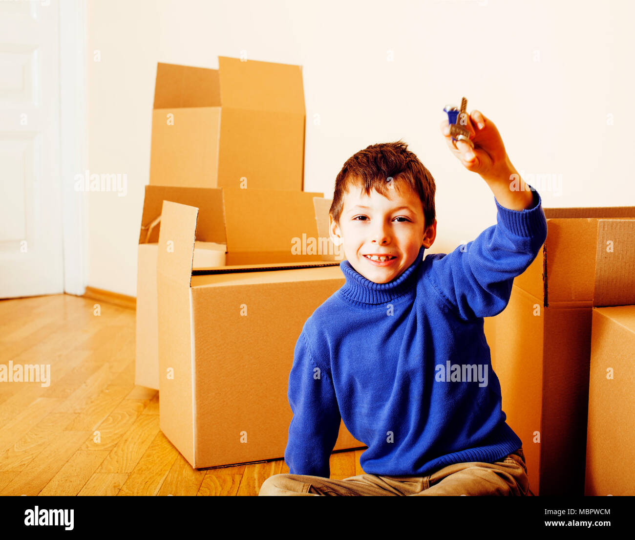little cute boy in empty room, remoove to new house. home alone Stock ...