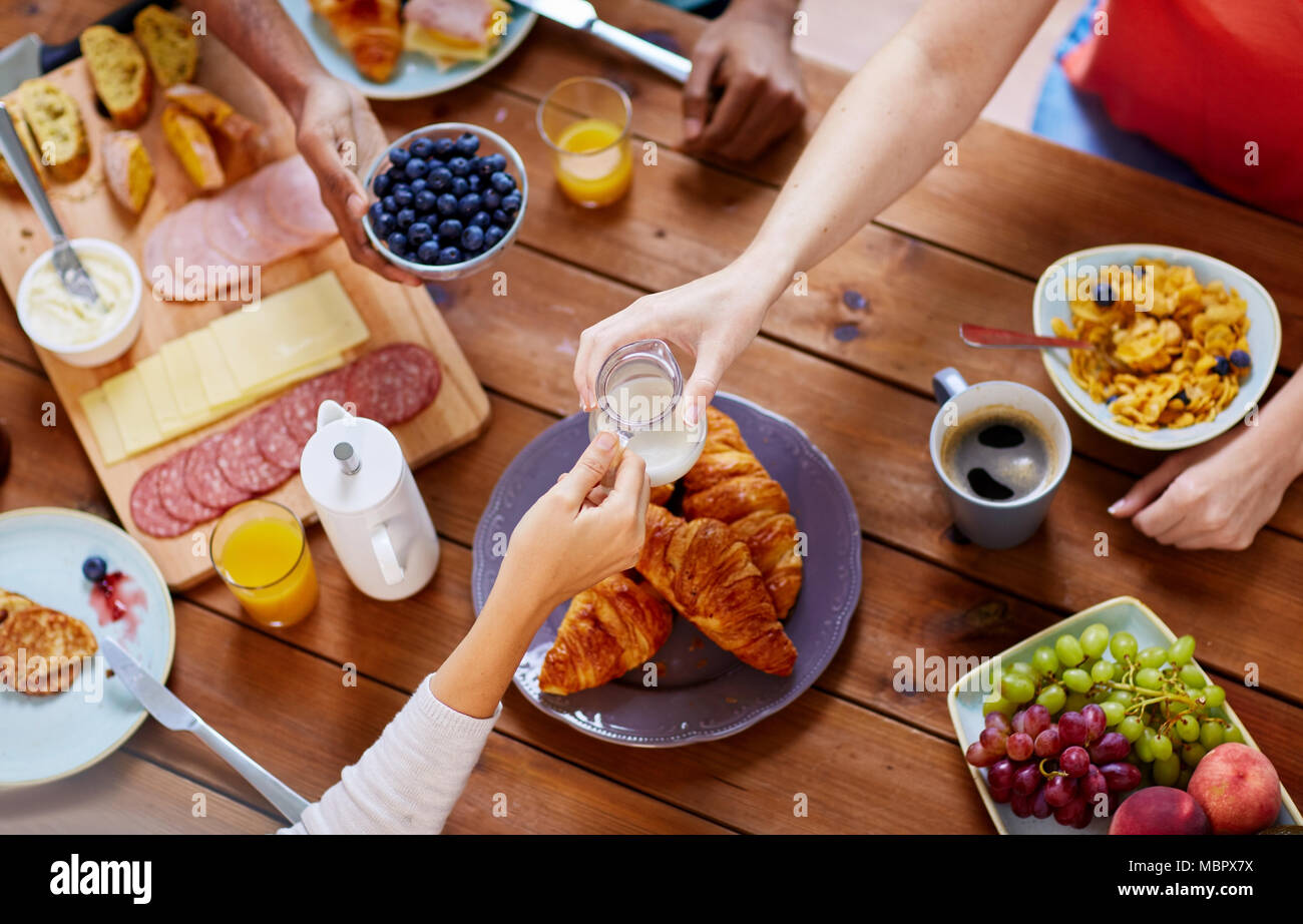 people having breakfast at table with food Stock Photo - Alamy