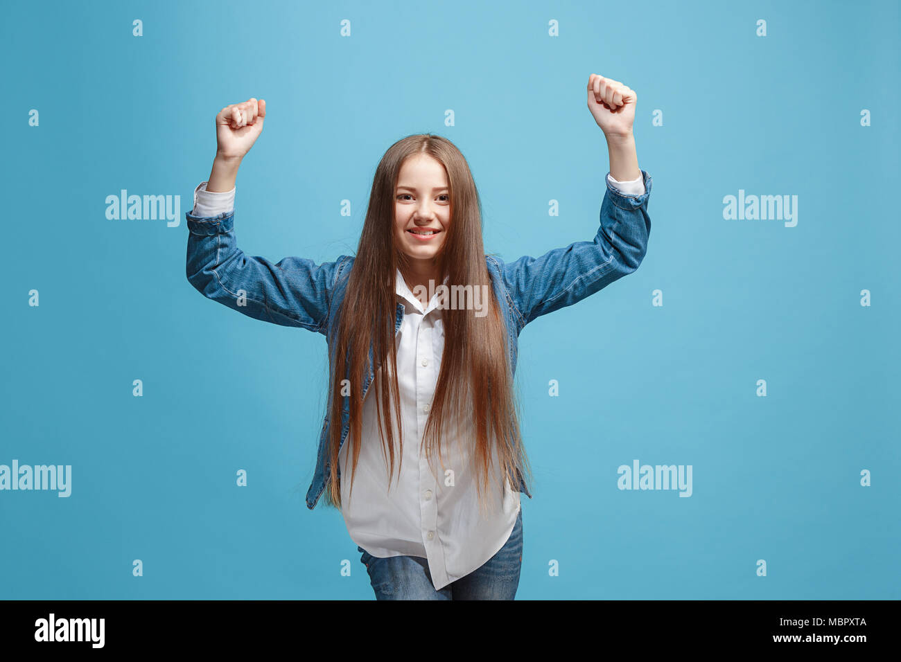 Happy success teen girl celebrating being a winner. Dynamic energetic ...