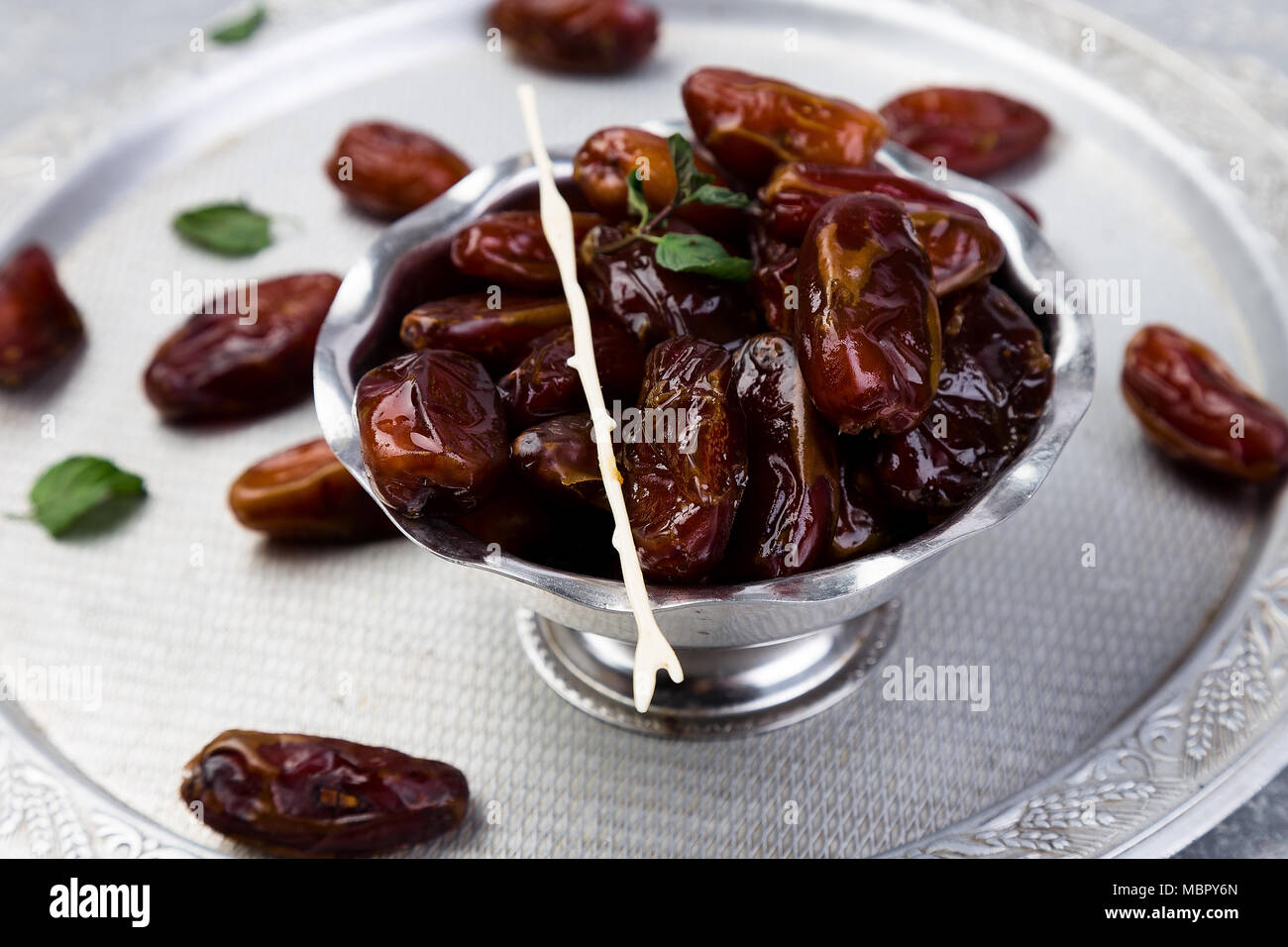 Dry fruit dates on silver tray. Copy space Stock Photo - Alamy