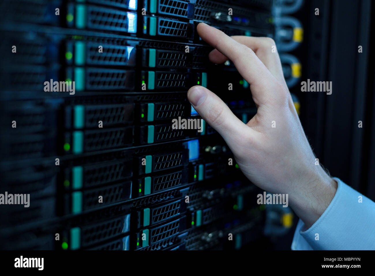 Smart operator pressing right buttons Stock Photo - Alamy