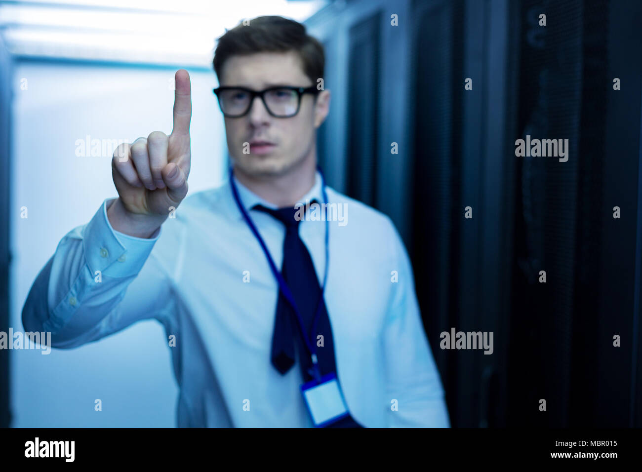 Professional man pointing his finger Stock Photo - Alamy