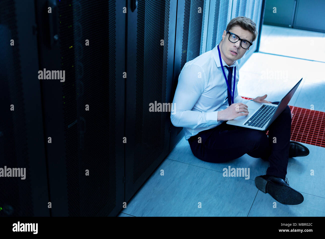Professional operator working on his laptop Stock Photo - Alamy