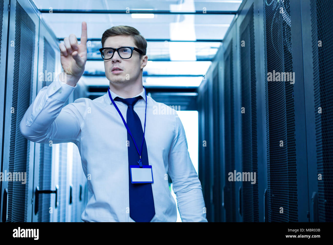 Skillful operator pointing with his finger Stock Photo - Alamy