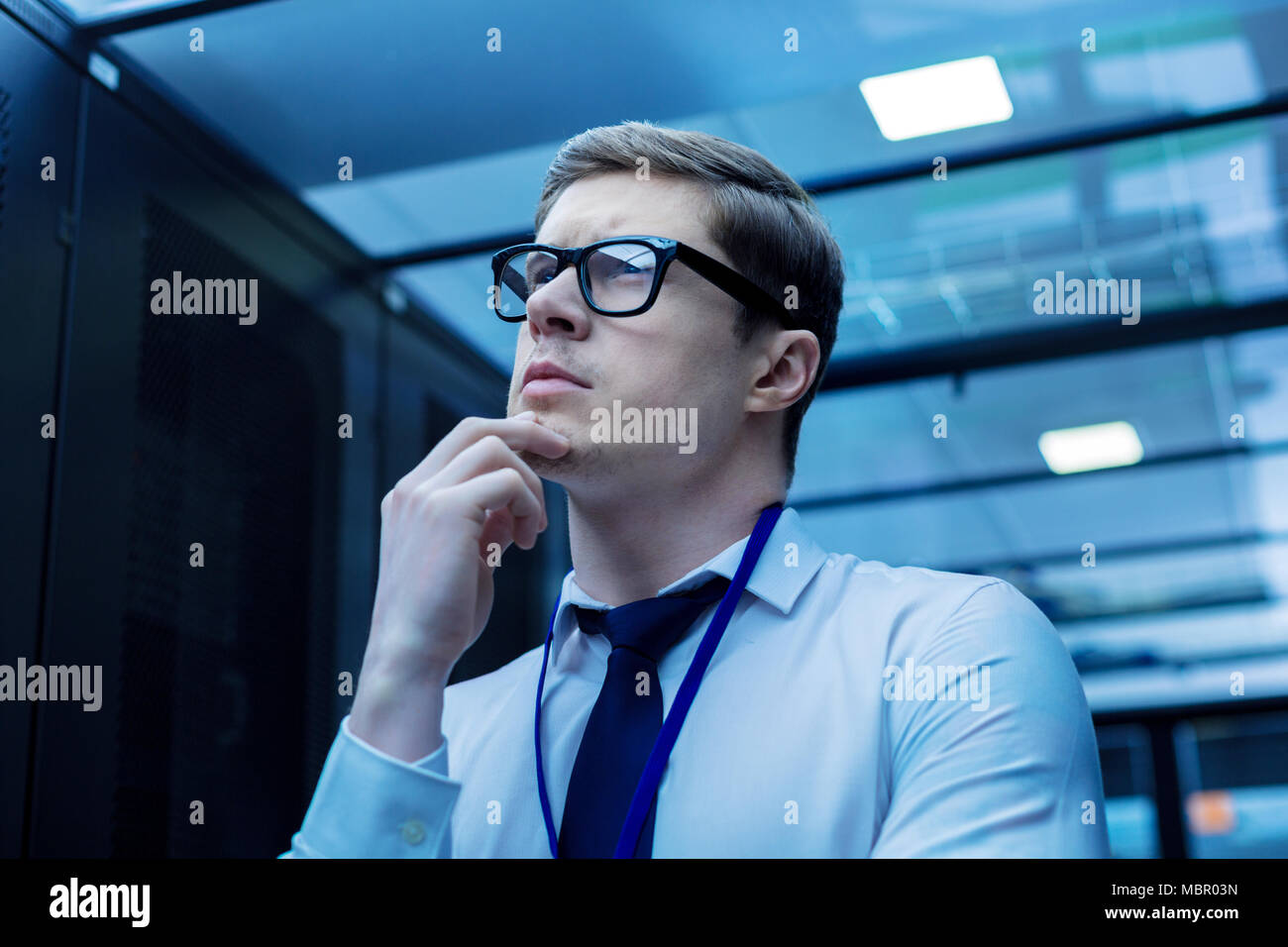 Experienced smart young operator thinking Stock Photo - Alamy