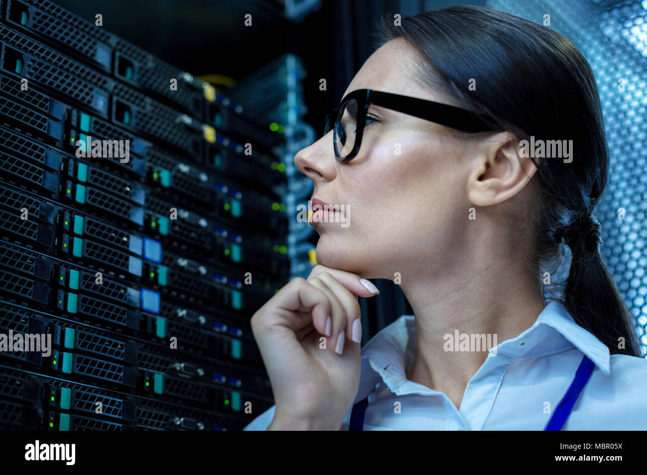 Serious operator looking at the equipment Stock Photo - Alamy