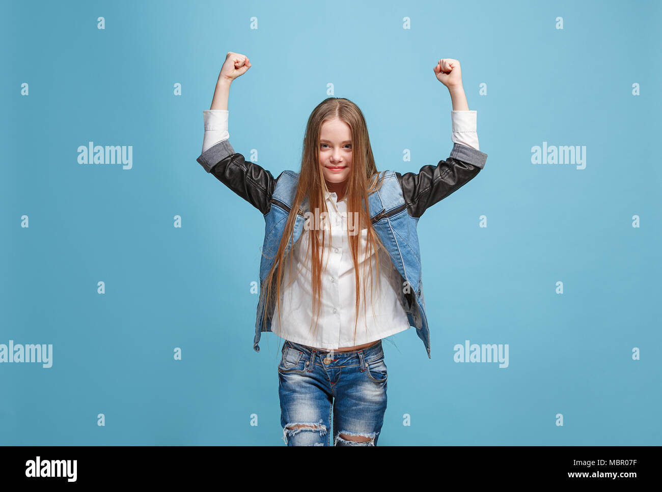 Happy success teen girl celebrating being a winner. Dynamic energetic ...