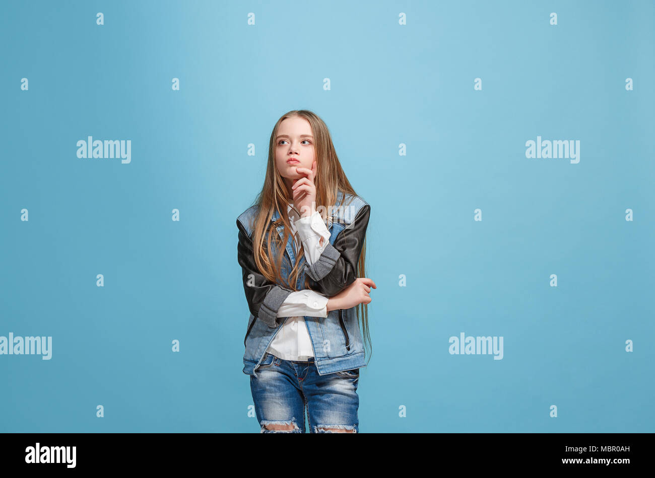 Young serious thoughtful teen girl. Doubt concept Stock Photo - Alamy
