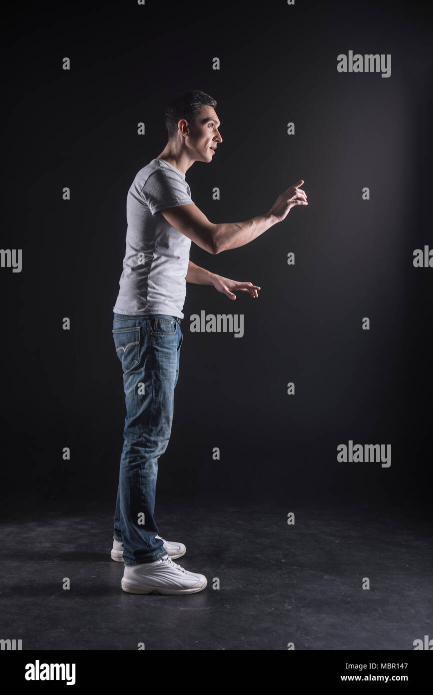 Smart handsome man using sensory panel Stock Photo - Alamy