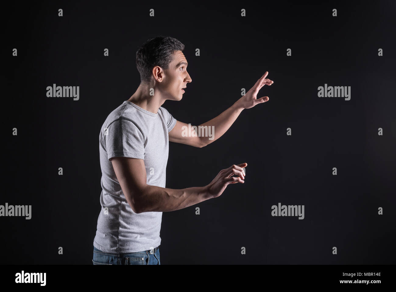 Nice handsome man looking at the computer screen Stock Photo - Alamy