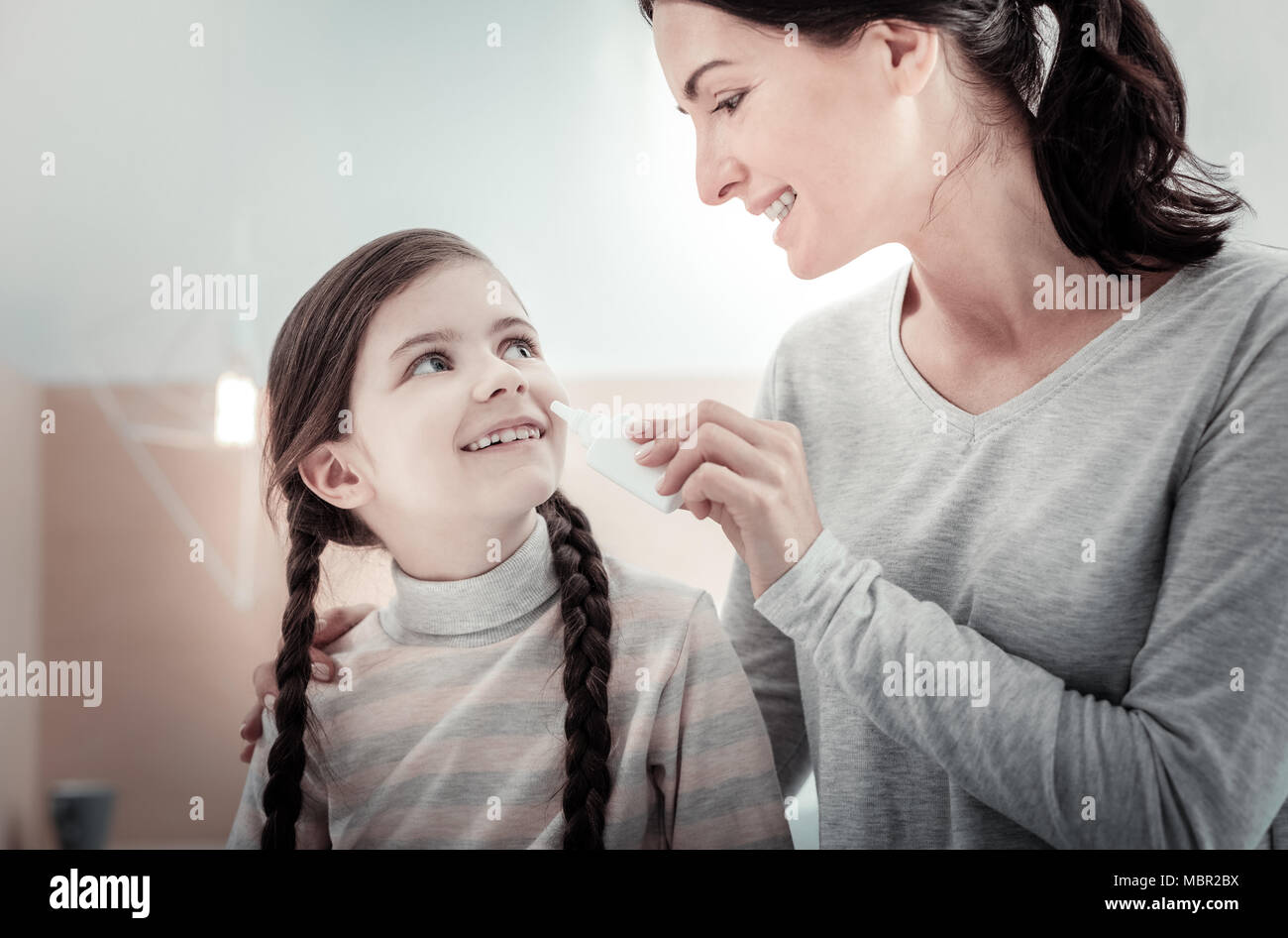 Mother caring for sick child hi-res stock photography and images - Alamy