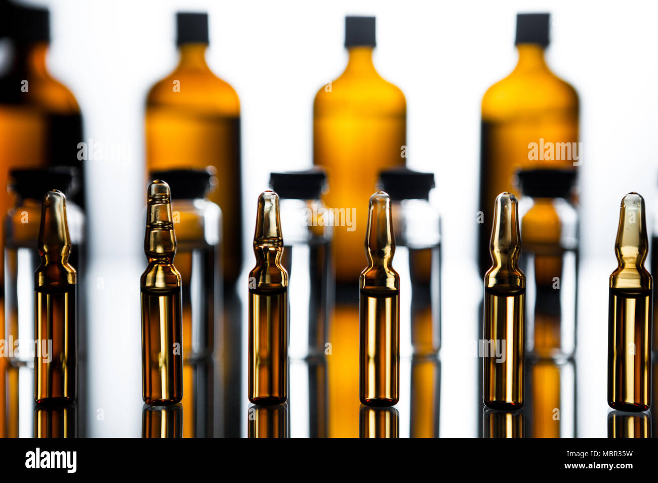 Group of ampoules with a transparent medicine in medical laboratory ...