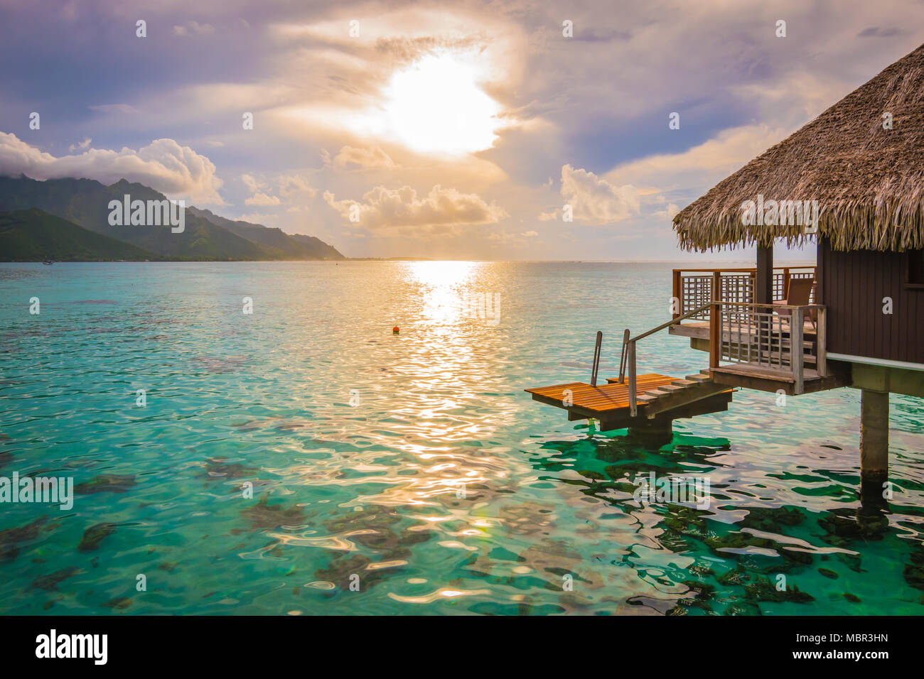 Overwater bungalow and lagoon at sunset. French Polynesia, Moorea Stock ...
