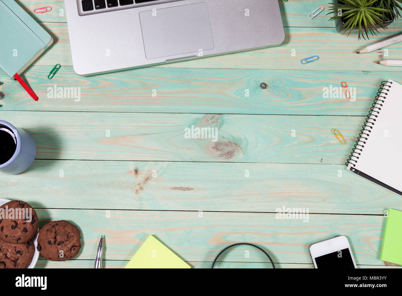 Blue office desk table with with office supplies. Top view with copy ...