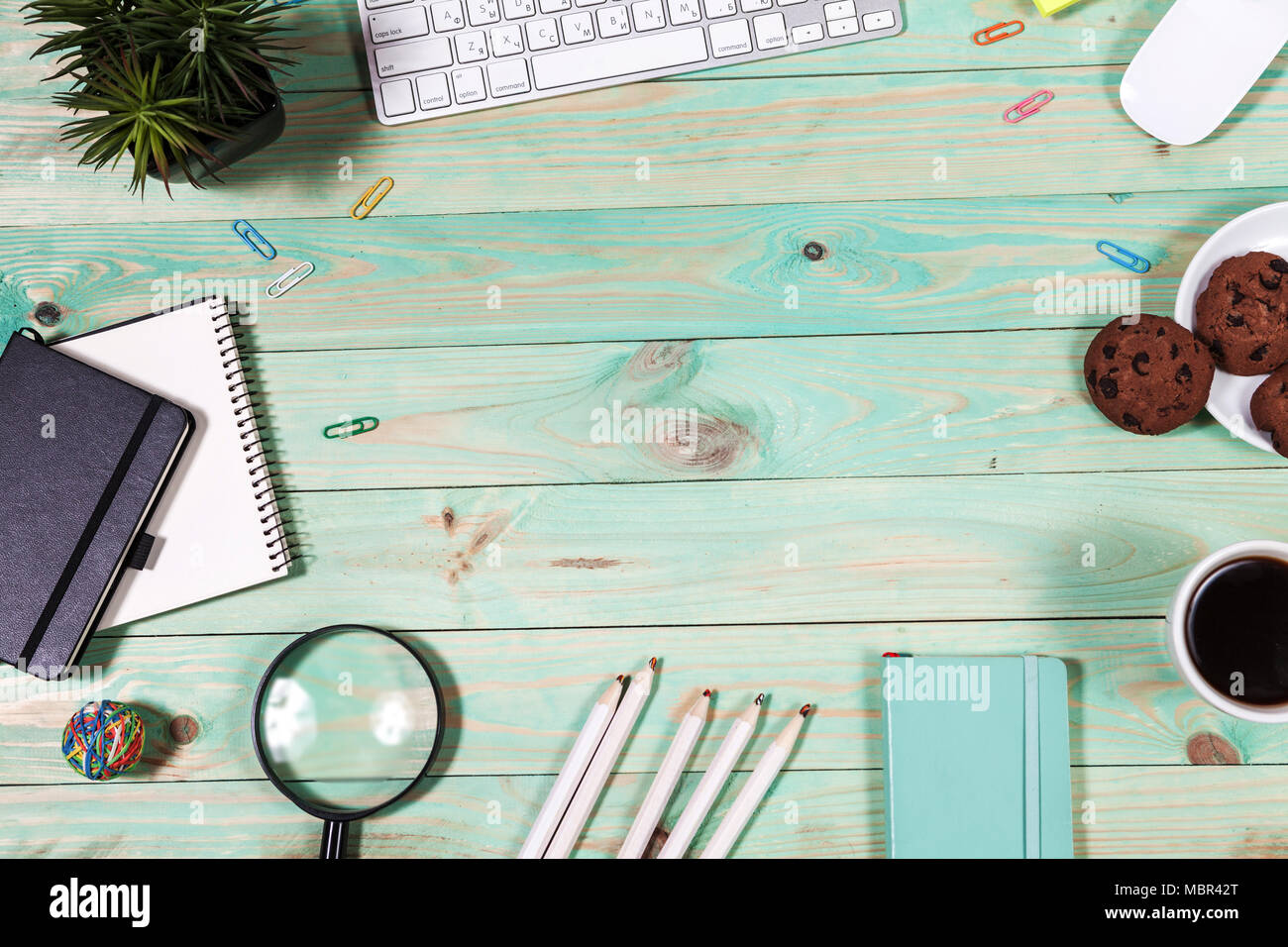 Blue office desk table with with office supplies. Top view with copy ...