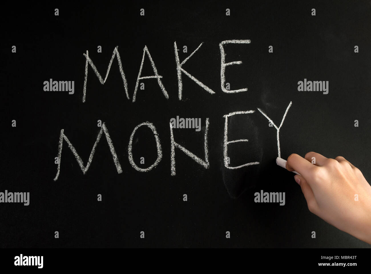 Girl hand write word Make Money with white chalk on blackboard Stock ...