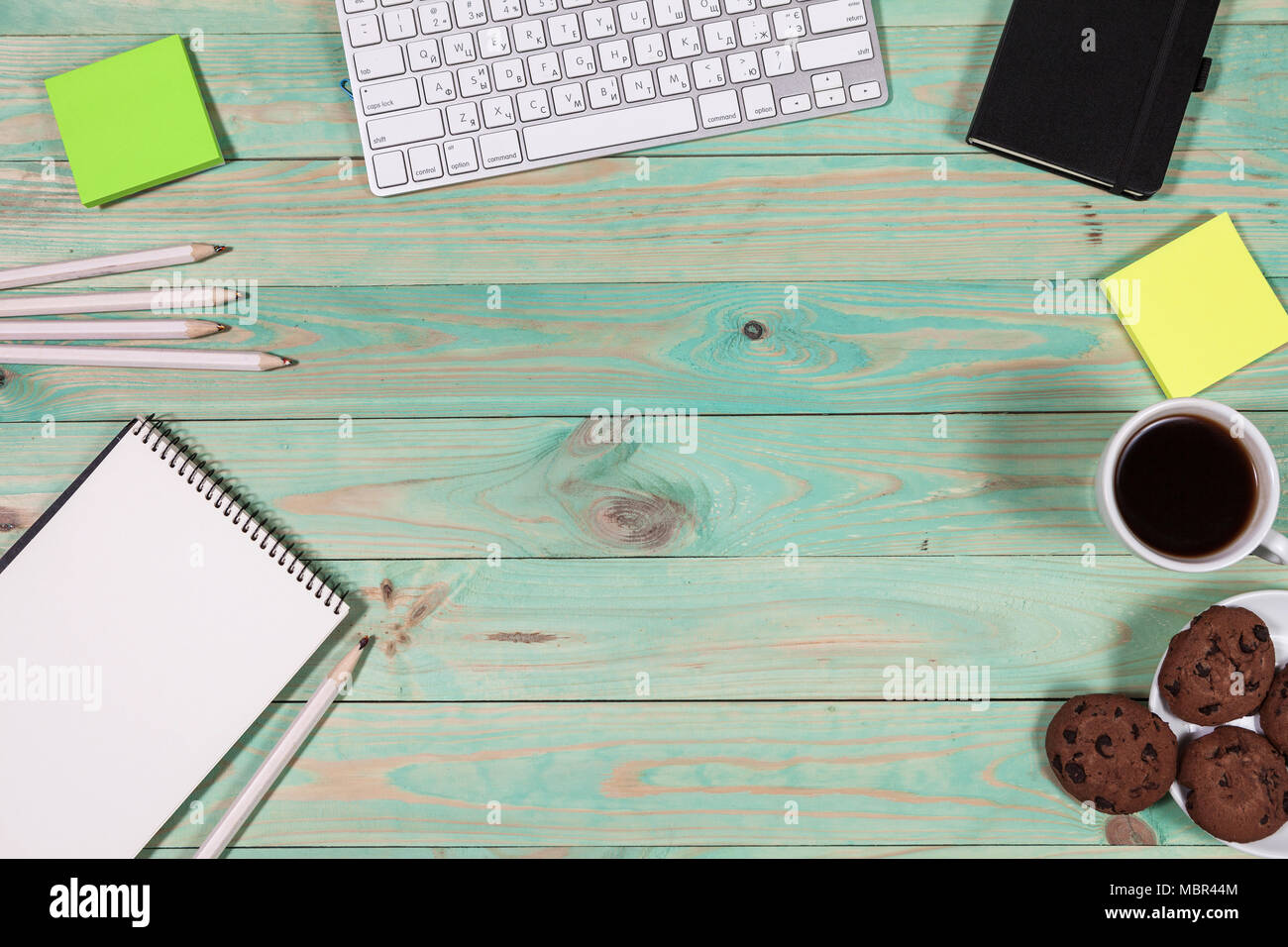 Blue office desk table with with office supplies. Top view with copy ...