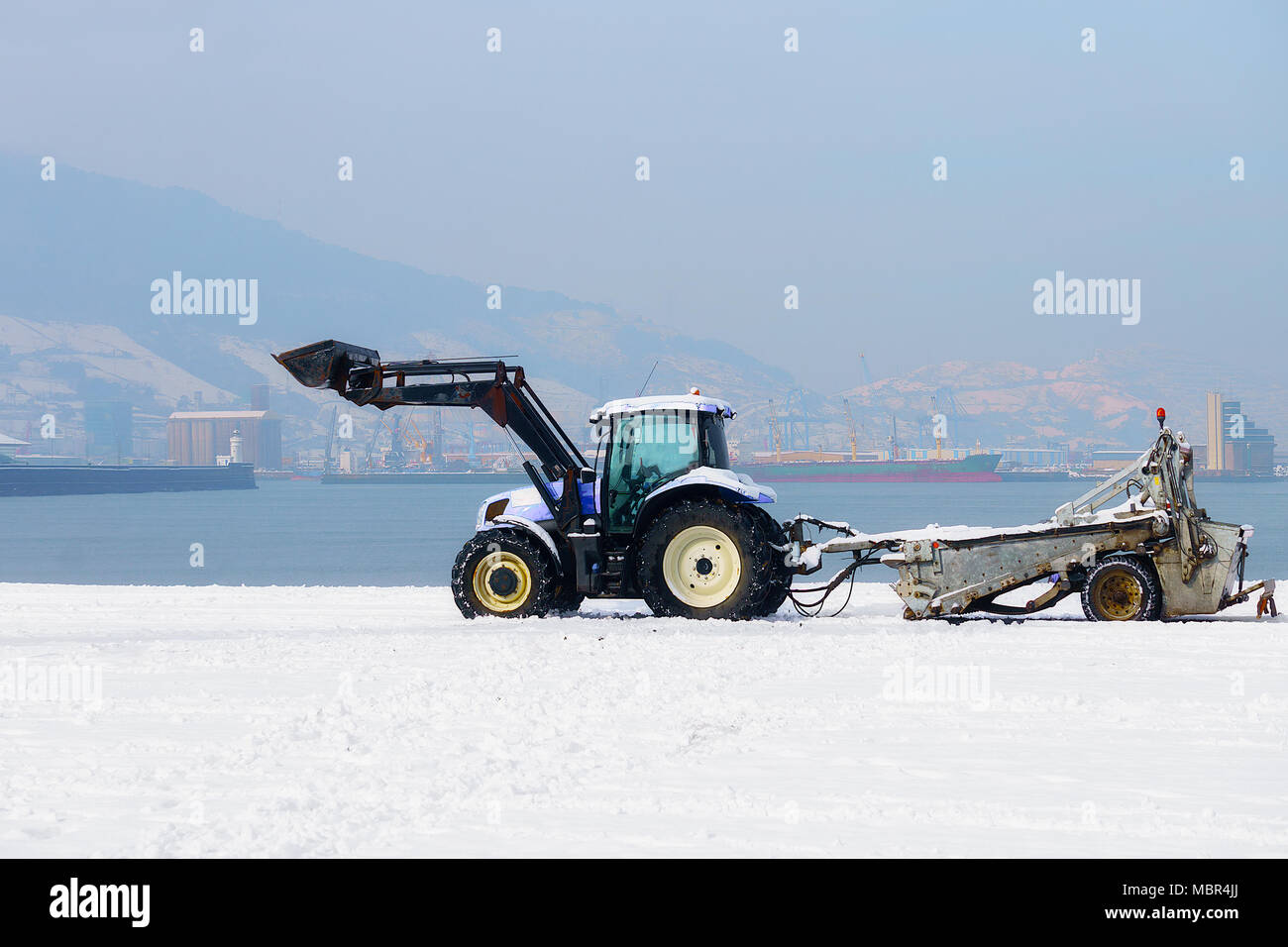 tractor machine cleaning snow Stock Photo - Alamy