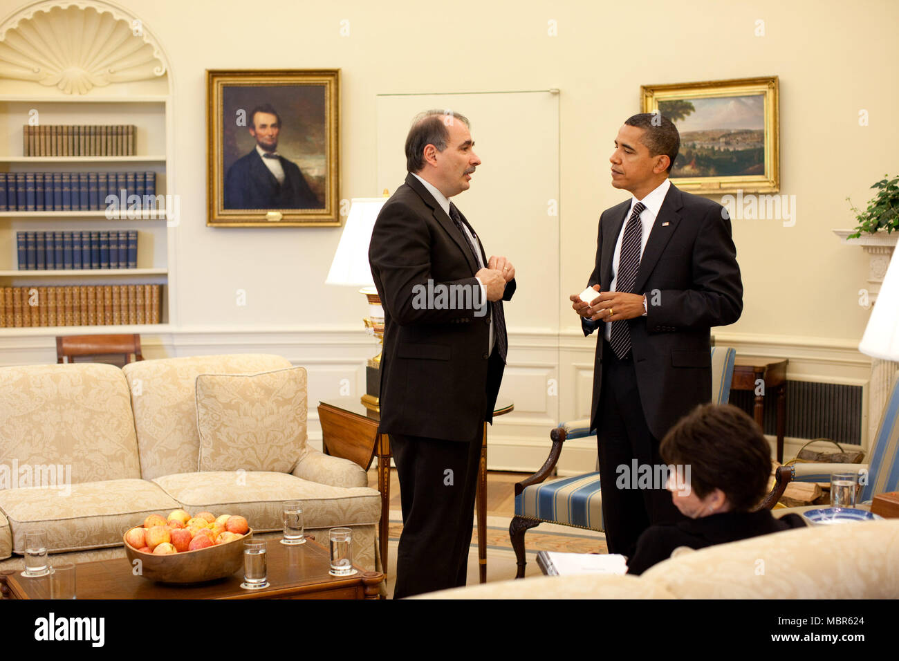 President Barack Obama talks with Senior Advisor David Axelrod at a ...