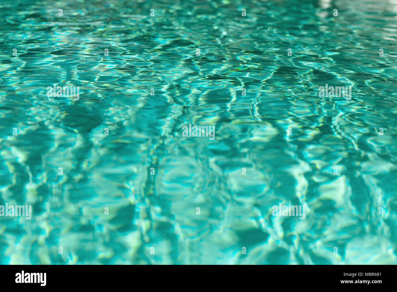 Close up abstract water texture. Turquoise swimming pool water ...