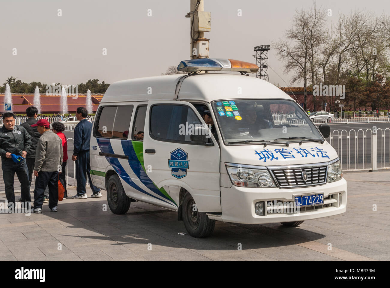 Beijing, China - April 27, 2010: White and blue police van parked on ...
