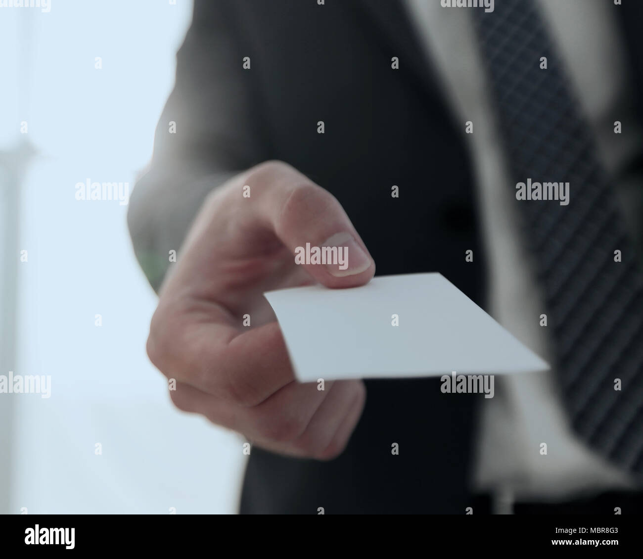 Business man giving business card on bright background Stock Photo - Alamy