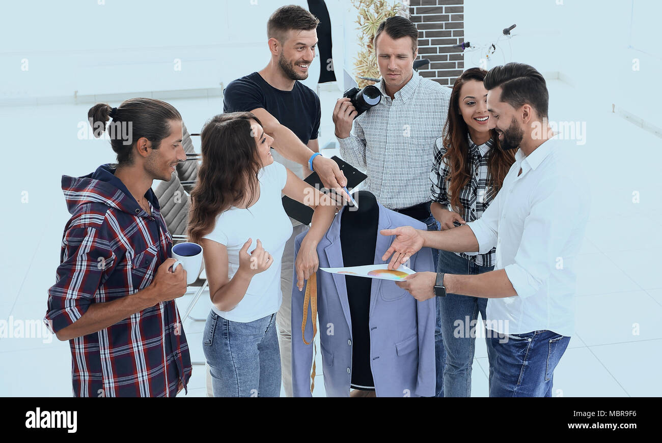 designers working with new models of men's clothing Stock Photo - Alamy