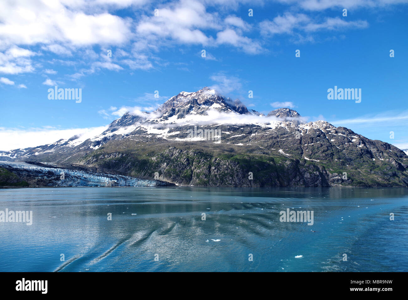 Snow-covered mountains surrounded by ocean near Alaska 2017 taken while ...