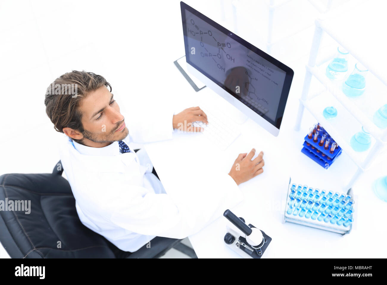 view from above of the scientist-doctor sitting on the computer Stock ...