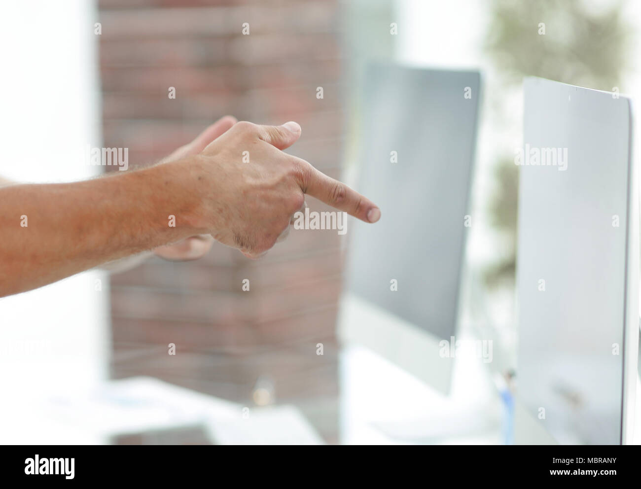 hand points to the computer monitor. business background Stock Photo ...